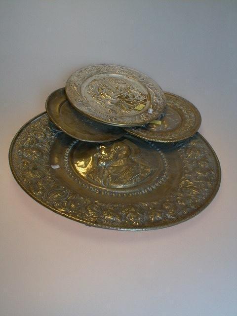 Five pressed brass chargers