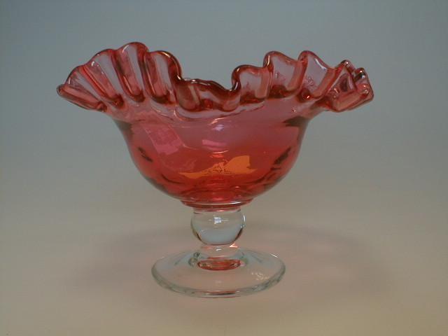 A Cranberry glass frill edged pedestal sugar basin
