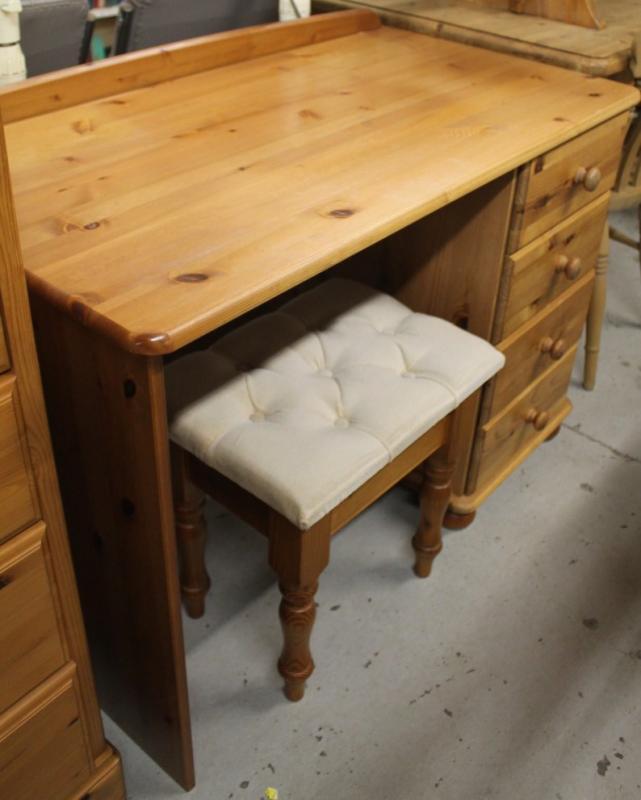 A modern stripped and lightly polished pine dressing table