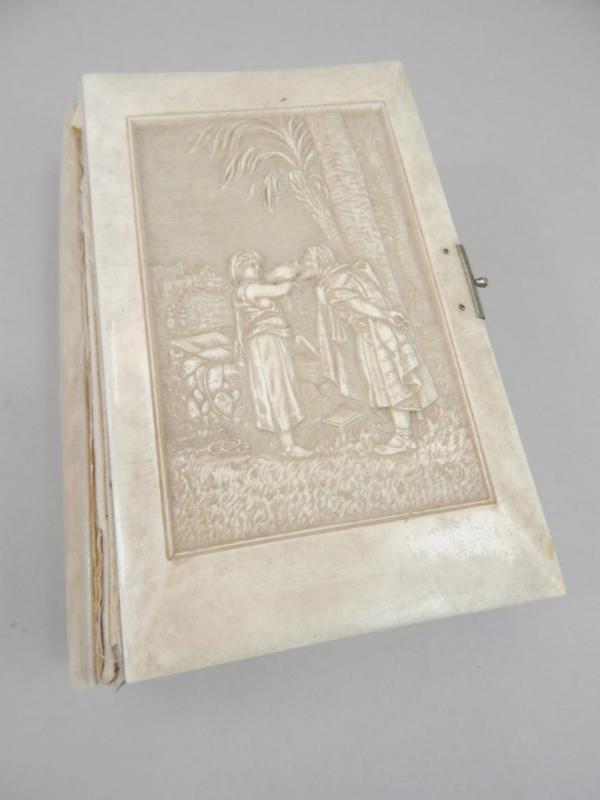 A 19thC carved ivory book cover