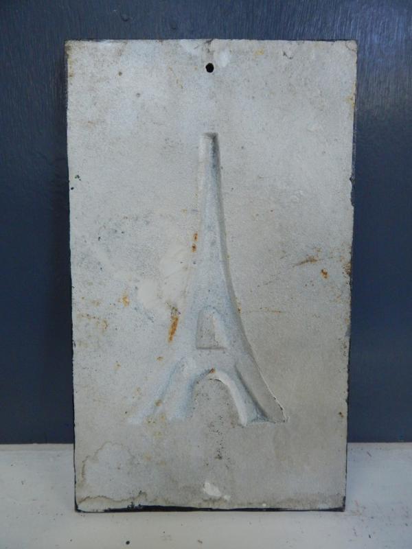 A cast iron La Tour Eiffel reproduction sign