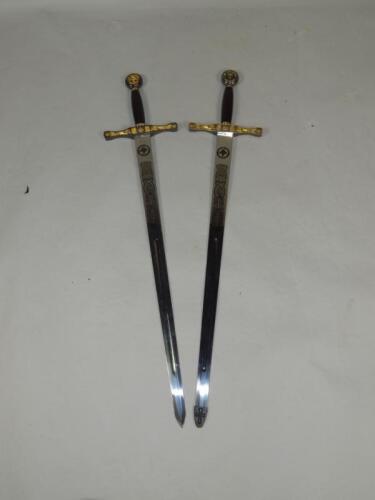 A pair of replica The King Reigns and his son swords