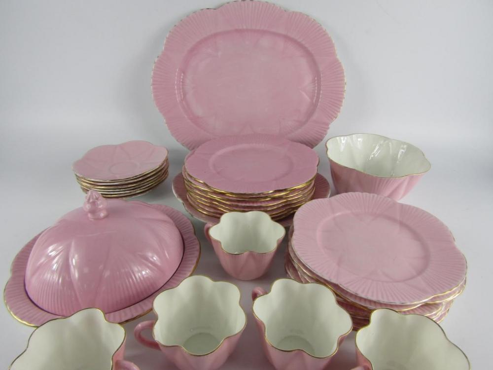 A Shelley pink ground porcelain fluted part tea service