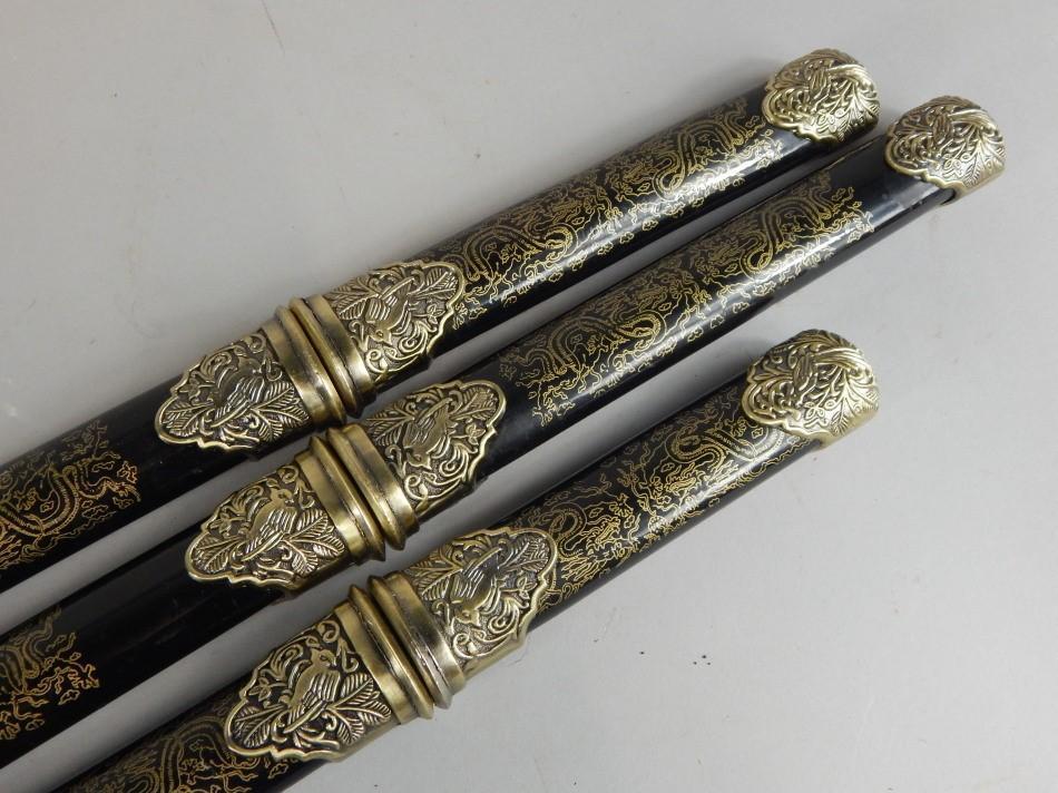Three modern reproduction Japanese swords