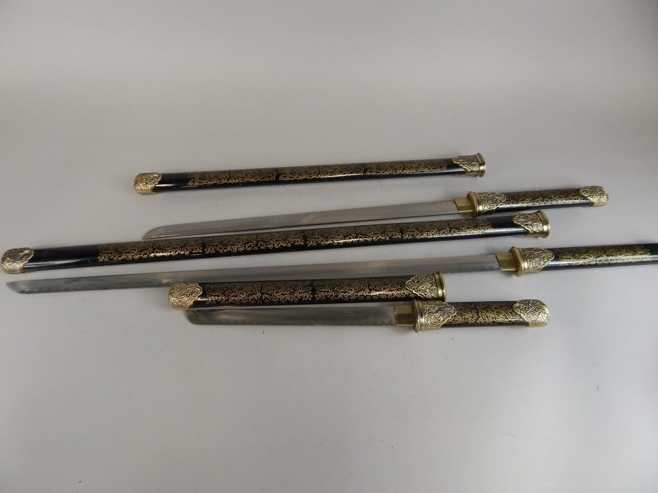 Three modern reproduction Japanese swords