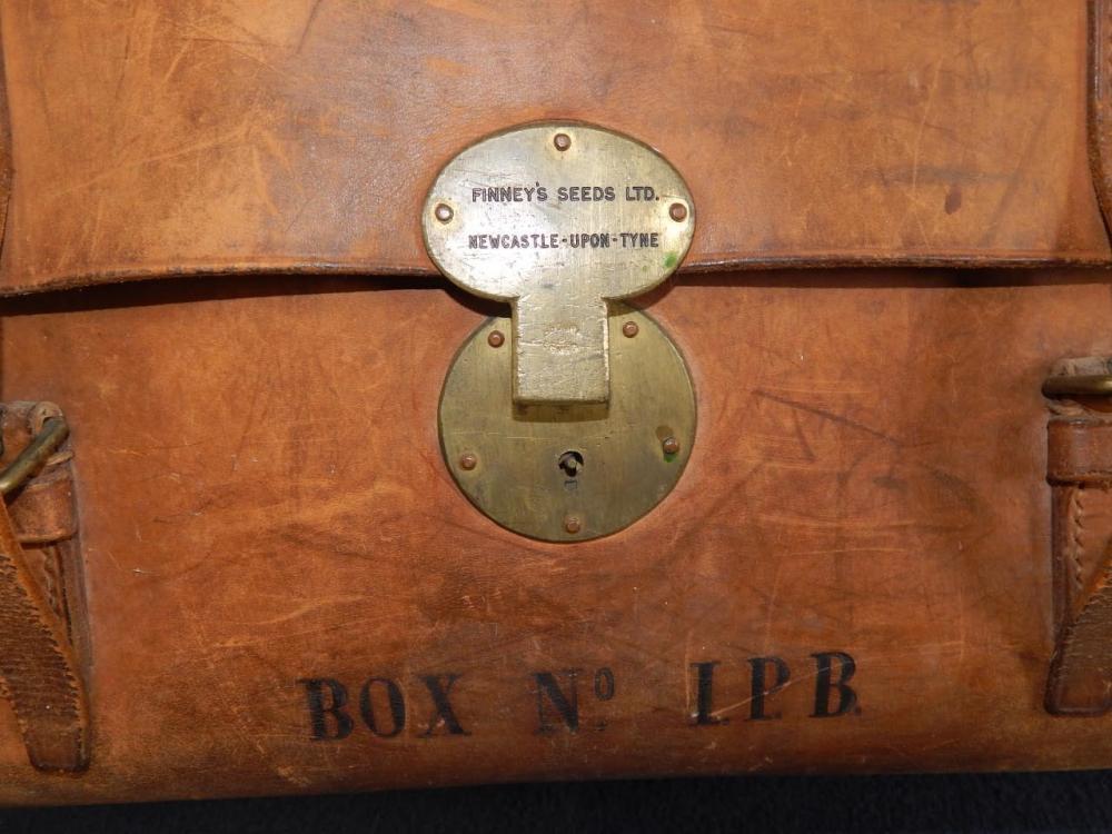 An early 20thc tan leather samples case for Finney's Seeds Ltd