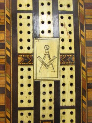 A Victorian masonic tunbridge ware and bone inlaid cribbage board
