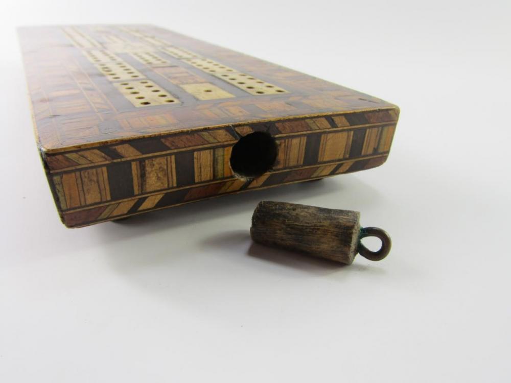 A Victorian masonic tunbridge ware and bone inlaid cribbage board