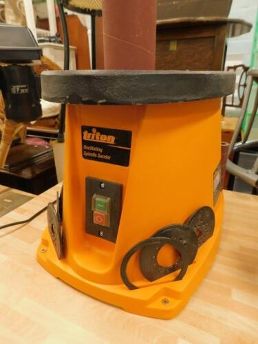 A Triton electric oscillating spindle sander and two metal stable hay ...