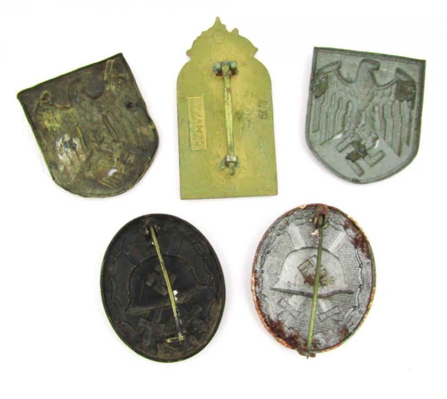 Various Nazi and German cap badges