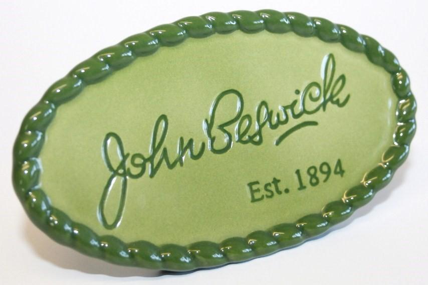 A John Beswick oval green plaque