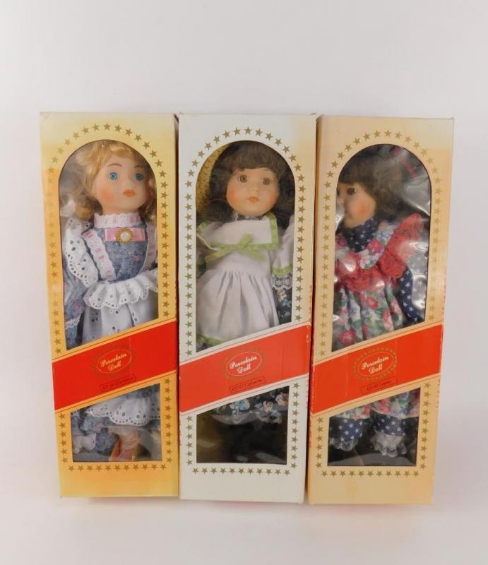 Three Excel Plus porcelain collector's dolls