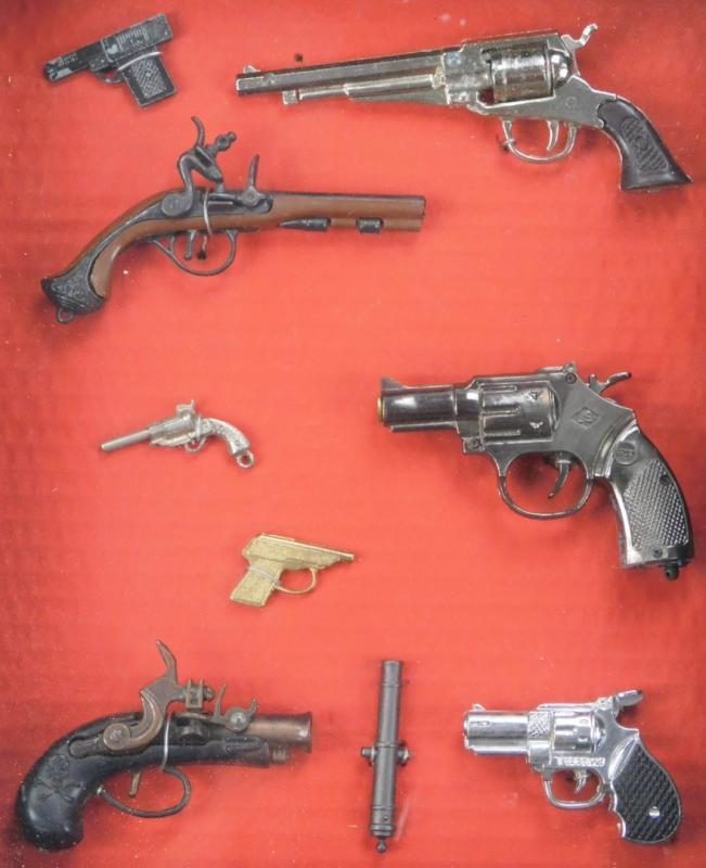 A cased set of miniature replica pistols