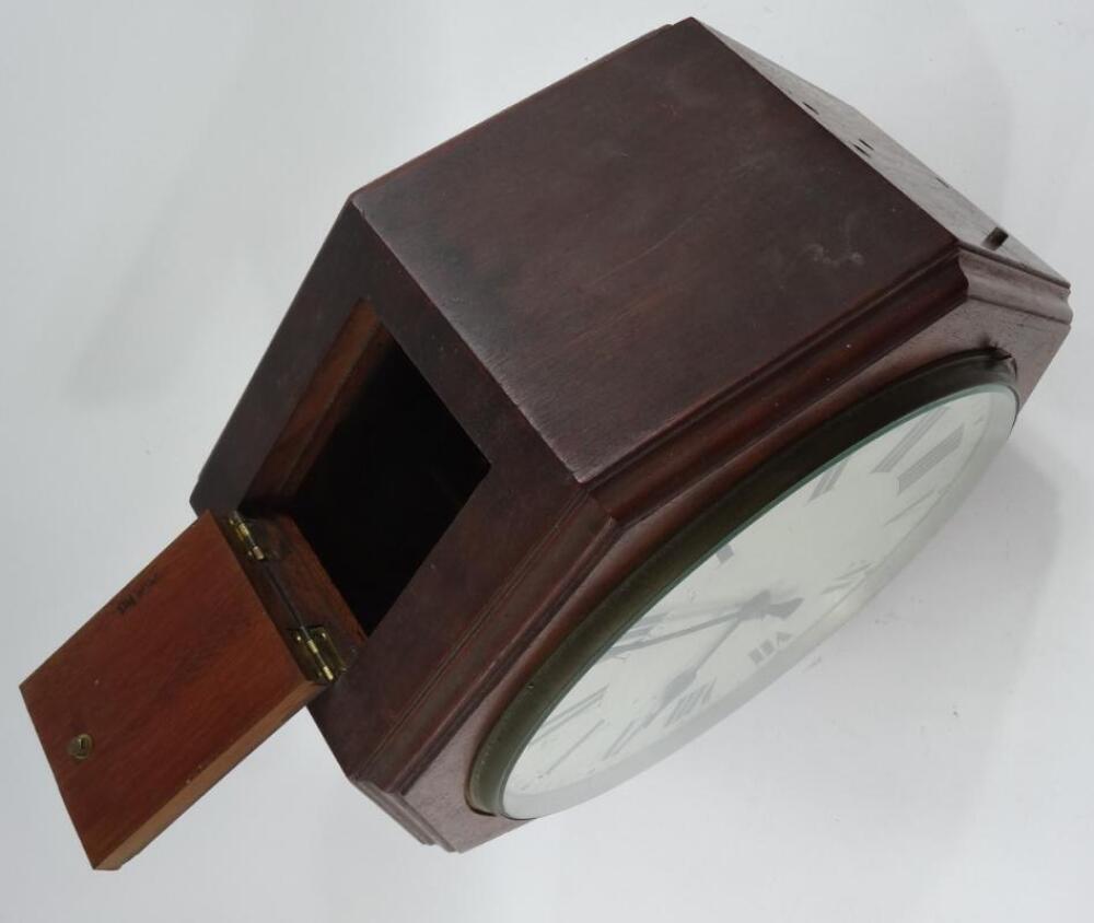 A GPO late 20thC mahogany octagonal cased double sided wall clock