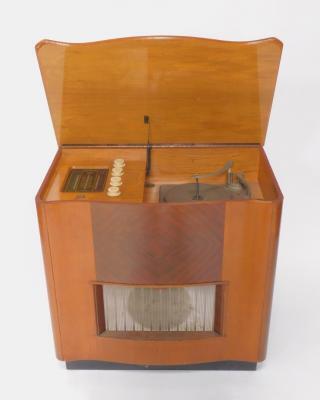 A Bush teak serpentine fronted radiogram