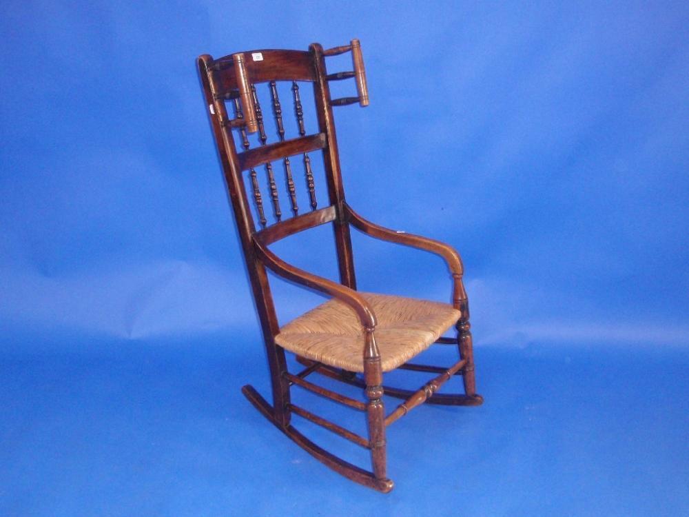 19th century beech spindle back rocking chair with rush seat