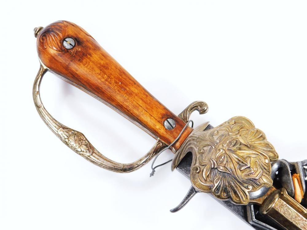 A reproduction flintlock pistol knife gun