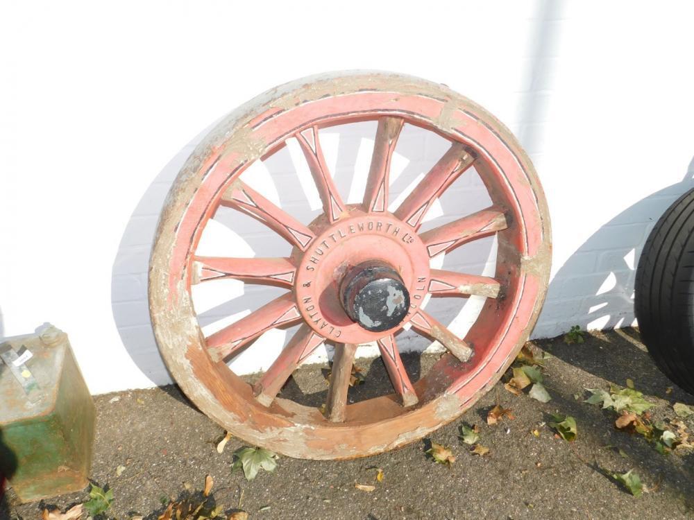 A Clayton & Shuttleworth Ltd wooden traction engine wheel