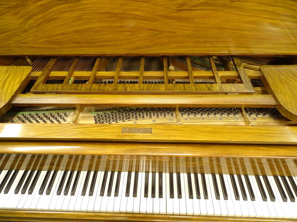 A walnut and simulated walnut baby grand piano by Ascherberg Perzina ...