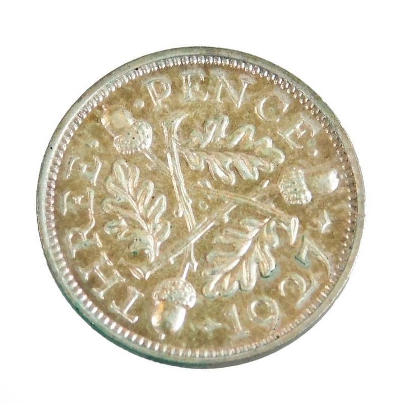 A 1927 3d threepence coin.