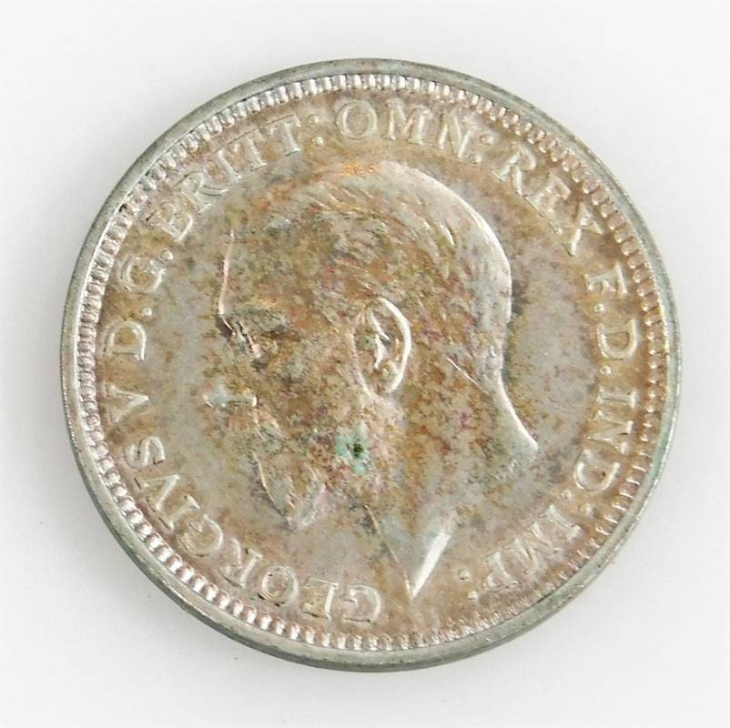 A 1927 3d threepence coin.