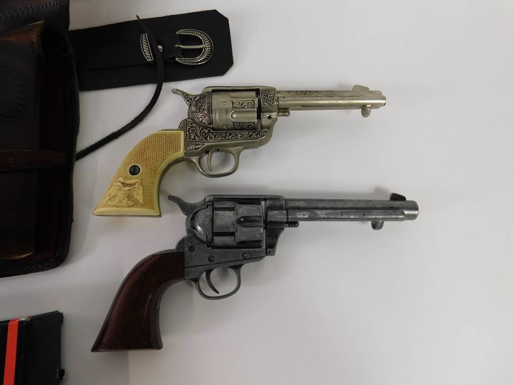 A replica Colt Pistol, with holster, belt and ammunition, further Colt ...