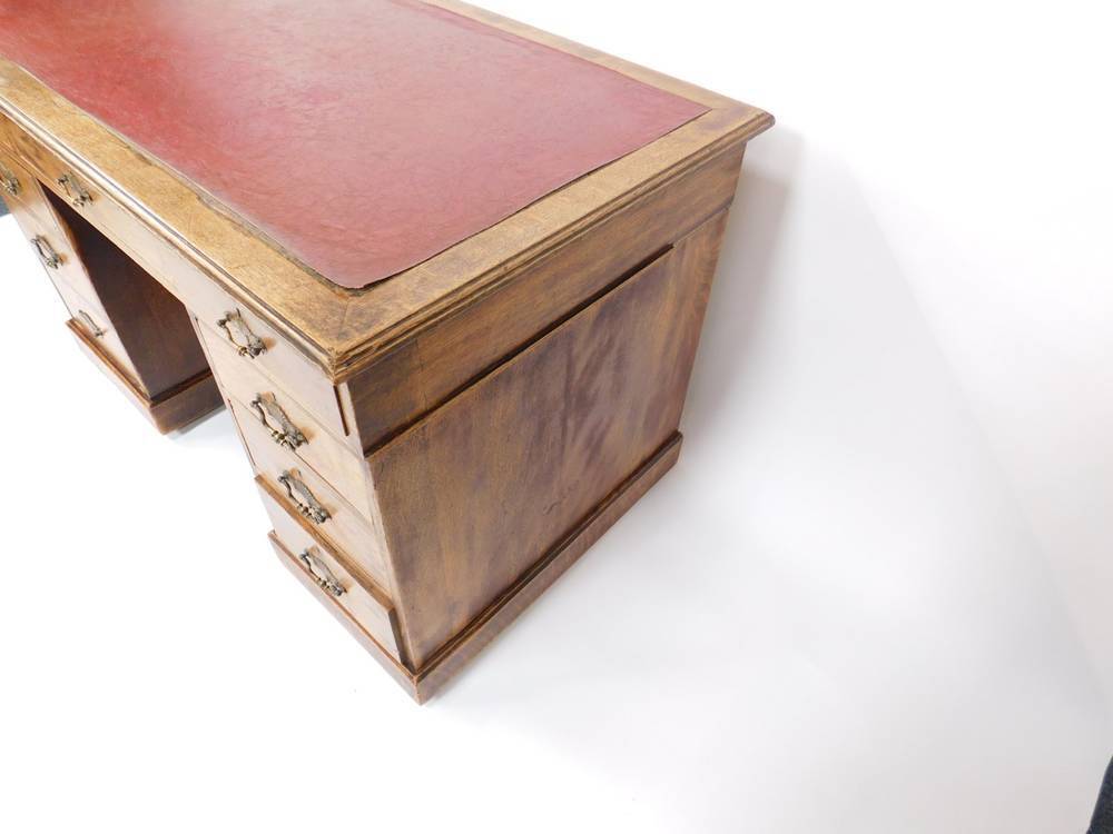 A Victorian oak twin pedestal desk, with faux leather top, over one ...