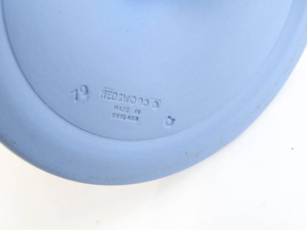 A collection of Wedgwood Jasperware, mainly blue but also a green ...