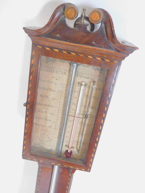 A mahogany marquetry and checker banded stick barometer, the paper dial ...