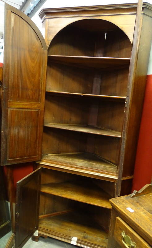 A George III mahogany standing corner cupboard, with moulded cornice ...
