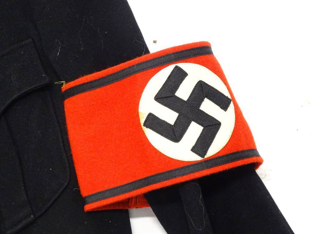 A German Third Reich style jacket, with woven silver oak leaf badges, a ...