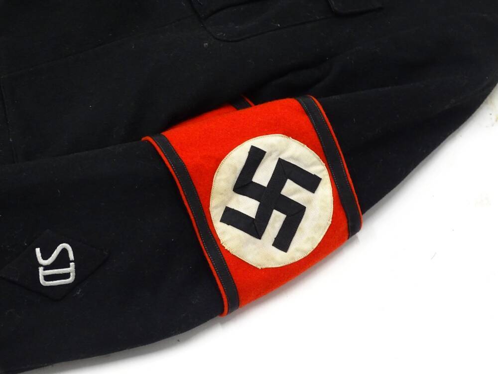 A German Third Reich style jacket, with silvered badges, Nazi party ...