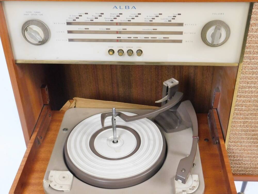 A Vintage Alba radiogram, with speaker front and articulated drawer, on ...