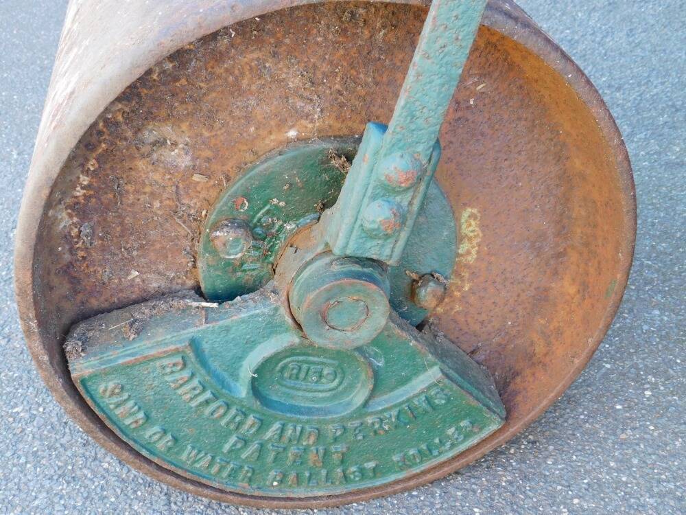 A Barford & Perkins heavy garden roller, with wrought iron handle and a ...