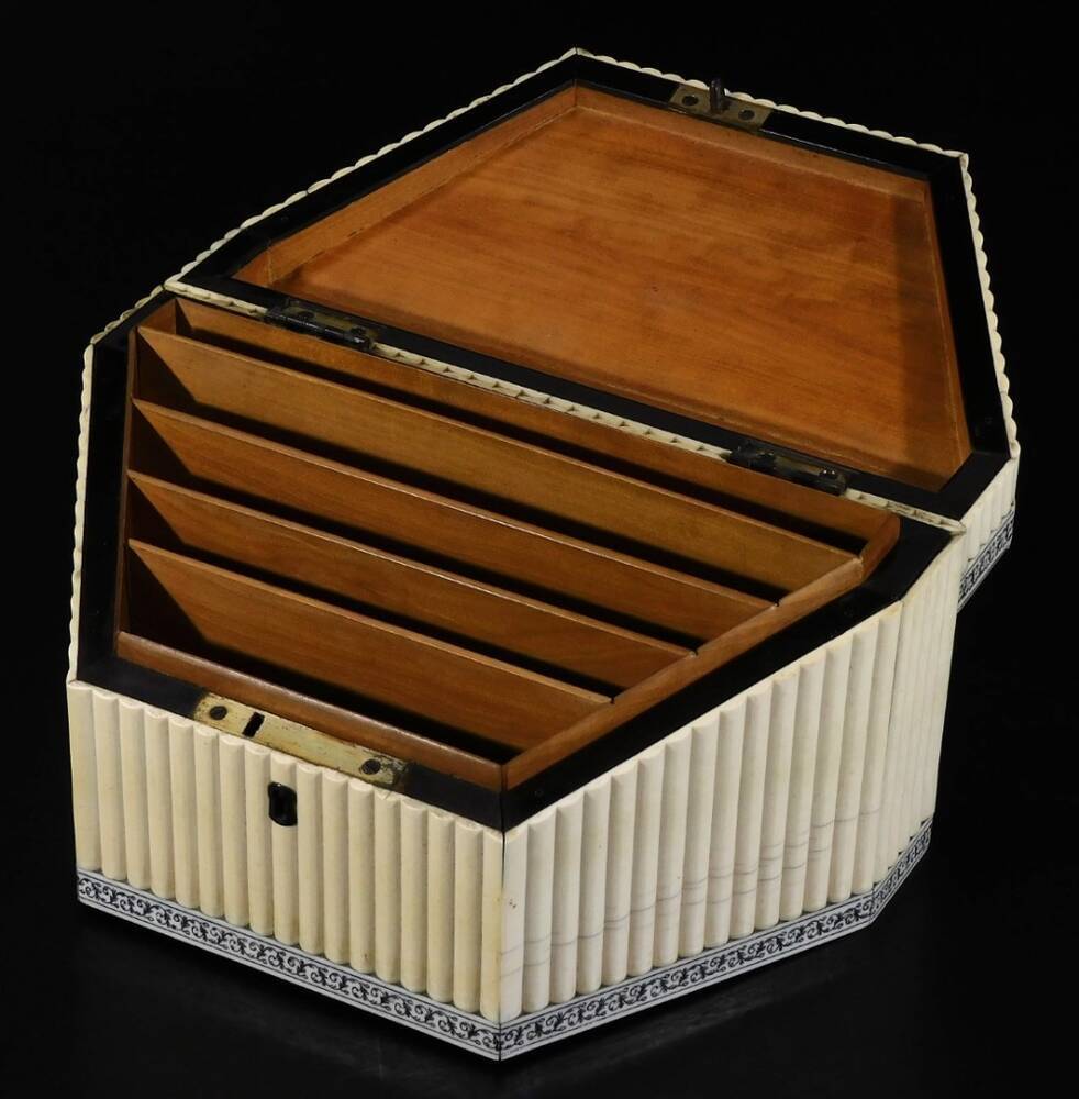 An early 19thC Anglo Indian Vizagapatam type ivory desk tidy, of shaped ...