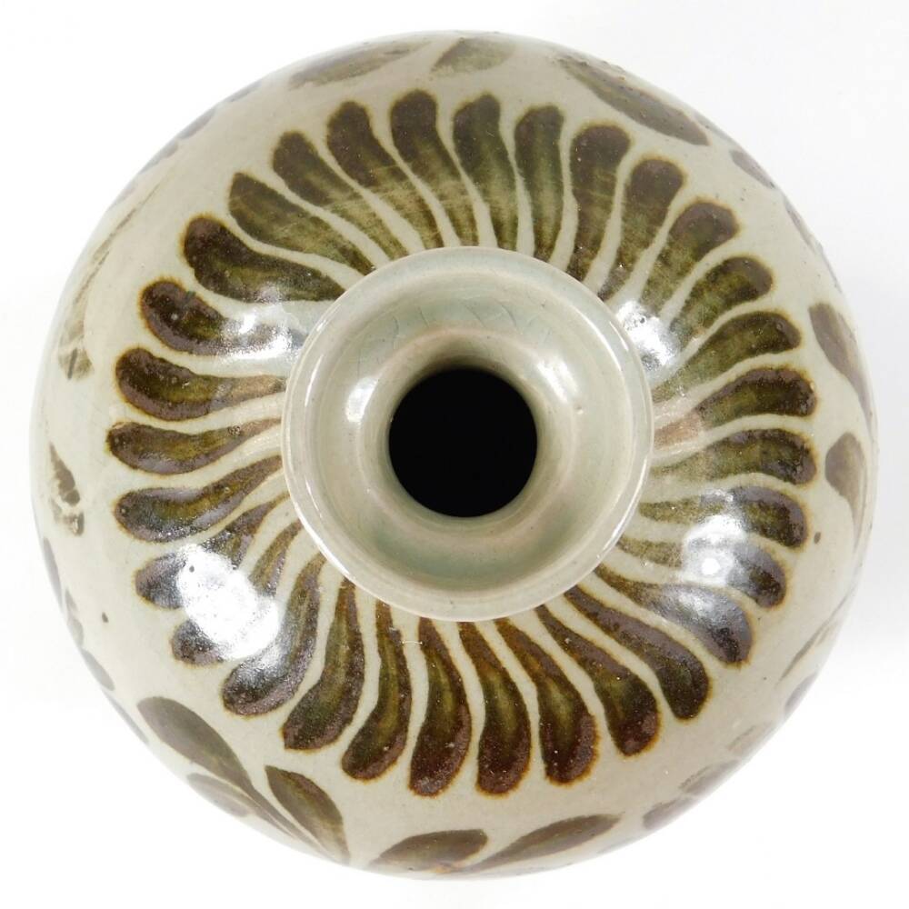 A Korean type pottery Koryo design vase, with a squat stem and a ...