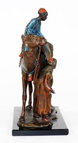 A cast and painted spelter figural table lighter, in the manner of ...