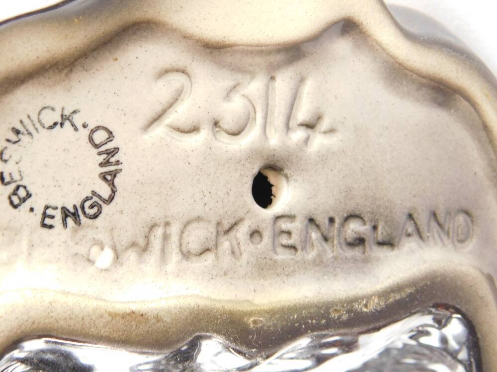 A Beswick Pottery Fireside figure of a black labrador, modelled in ...