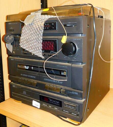 An Akai stacking hi-fi system with record player.