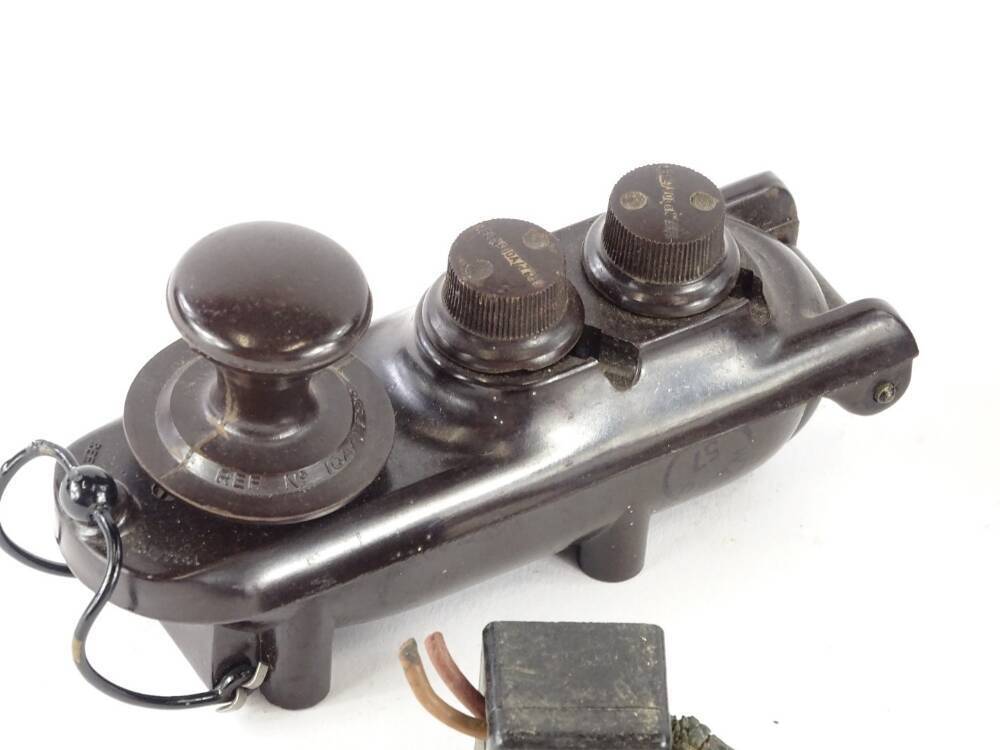 A Lancaster Bakelite Morse code key communicator, microphone snatch-plug and a bomb aimer's pull ...