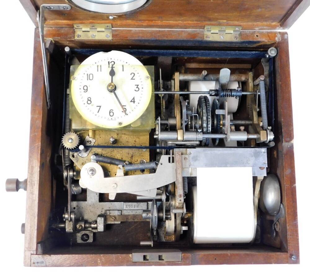 A Gensign mahogany cased pigeon racing timer clock, 32cm high, 35cm wide.