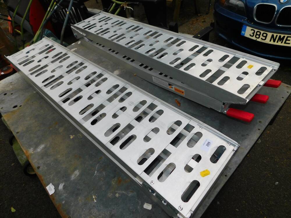 A pair of folding aluminium wheelchair or buggy ramps, each circa 2 ...