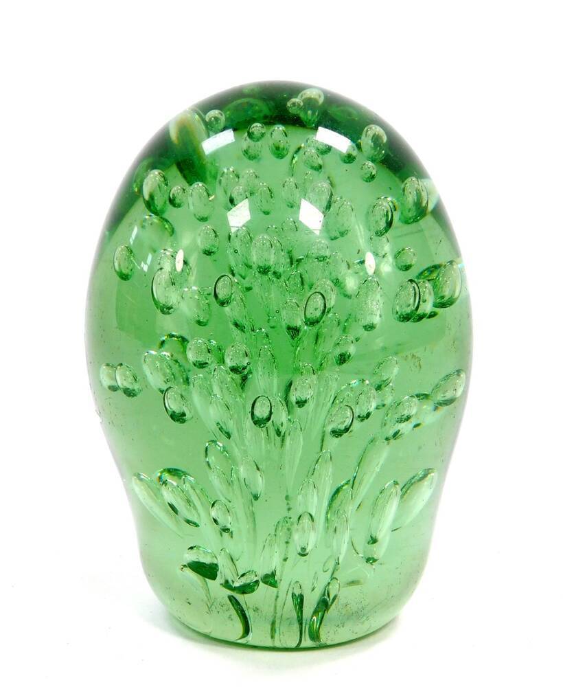 A Victorian green glass dump paperweight, with cascading air bubble ...