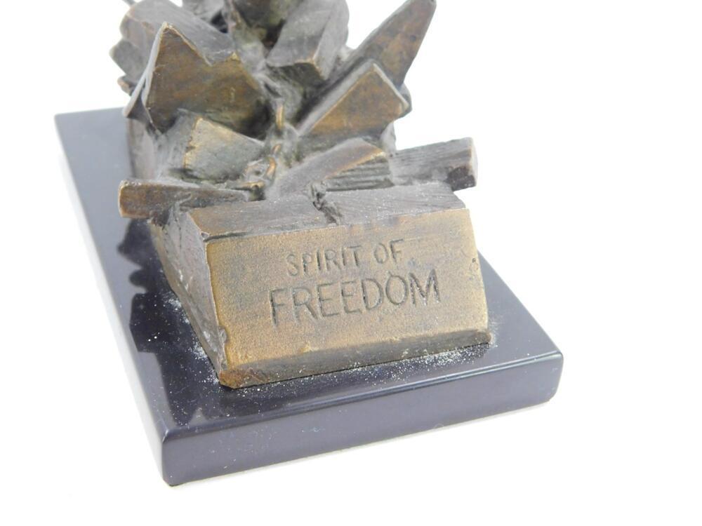 A bronze plaster figure modelled as Spirit of Freedom, with a posed ...