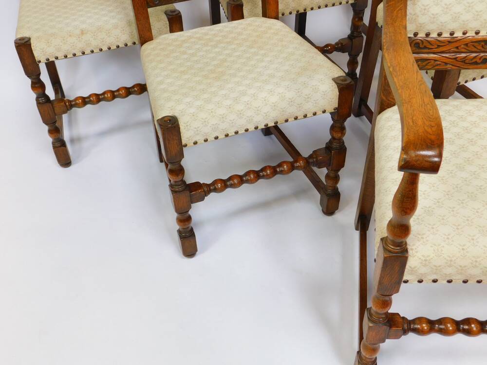 A set of six 17thC style oak dining chairs, with studded over stuffed ...