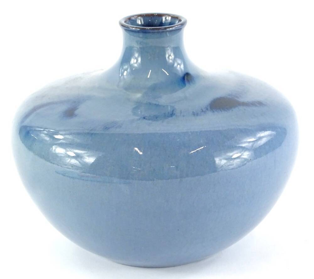 An Ashby Guild pottery vase, decorated with a blue flambe type glaze ...