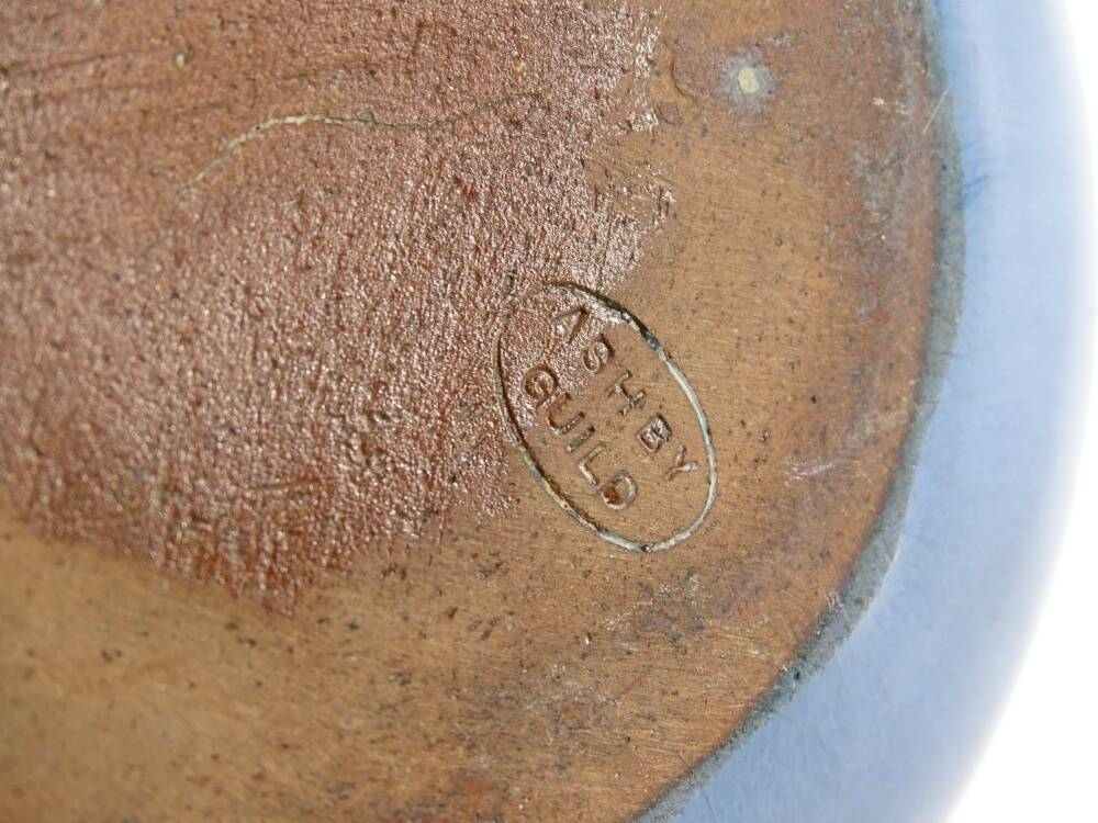 An Ashby Guild pottery vase, decorated with a blue flambe type glaze ...