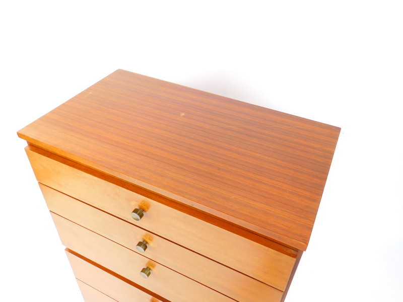 A Meredew teak chest, of five graduated drawers, raised on square ends ...