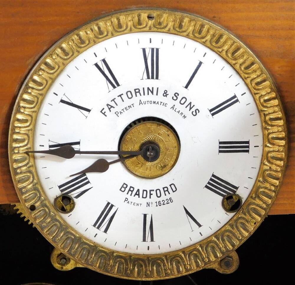 Fattorini. An early 20thC oak cased alarm mantel clock, the shaped case ...