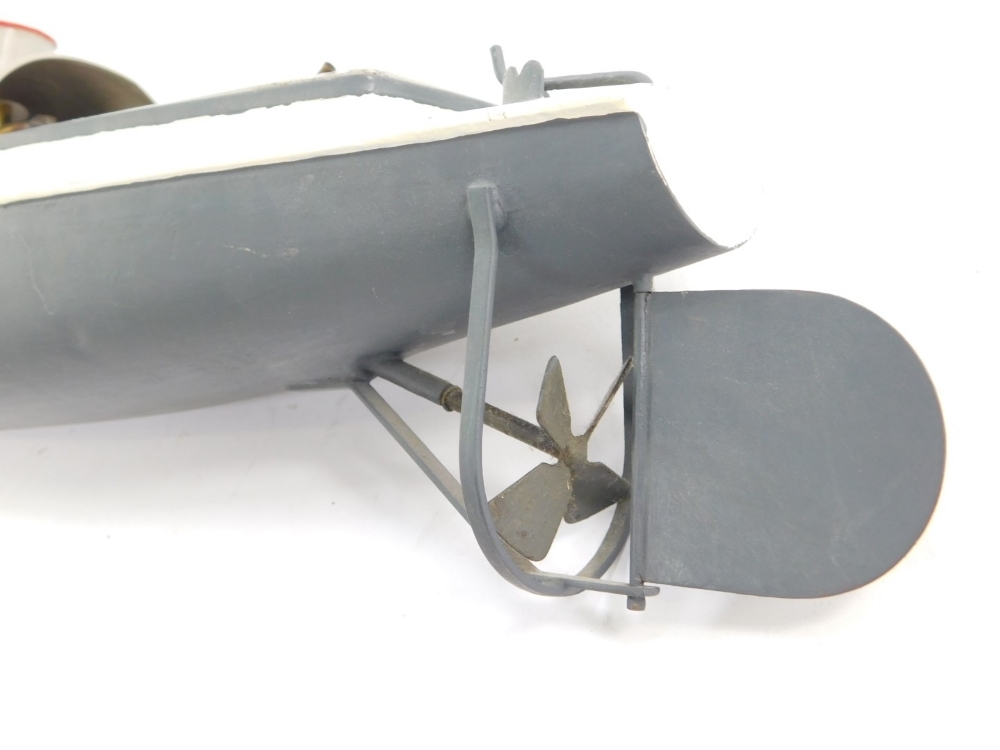 An early 20thC steam driven metal framed model motor cruiser, painted ...